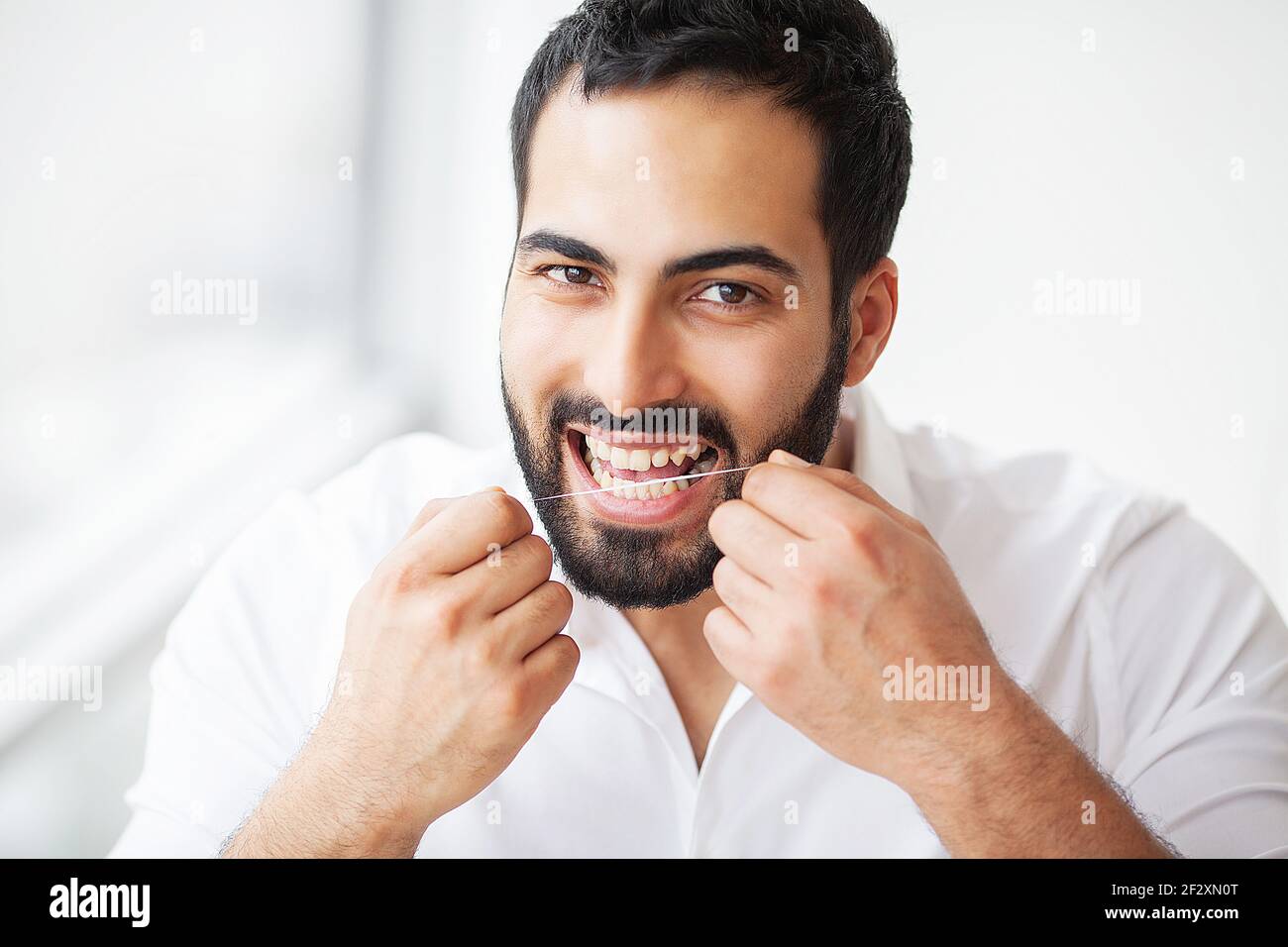 Boy flossing teeth hi-res stock photography and images - Alamy