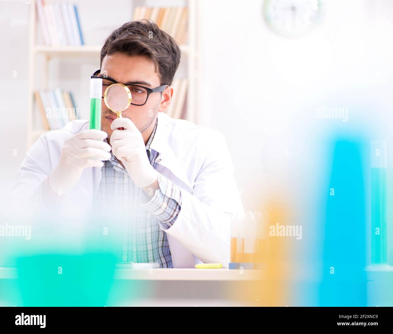 Chemistry student doing chemical experiments at classroom activity ...