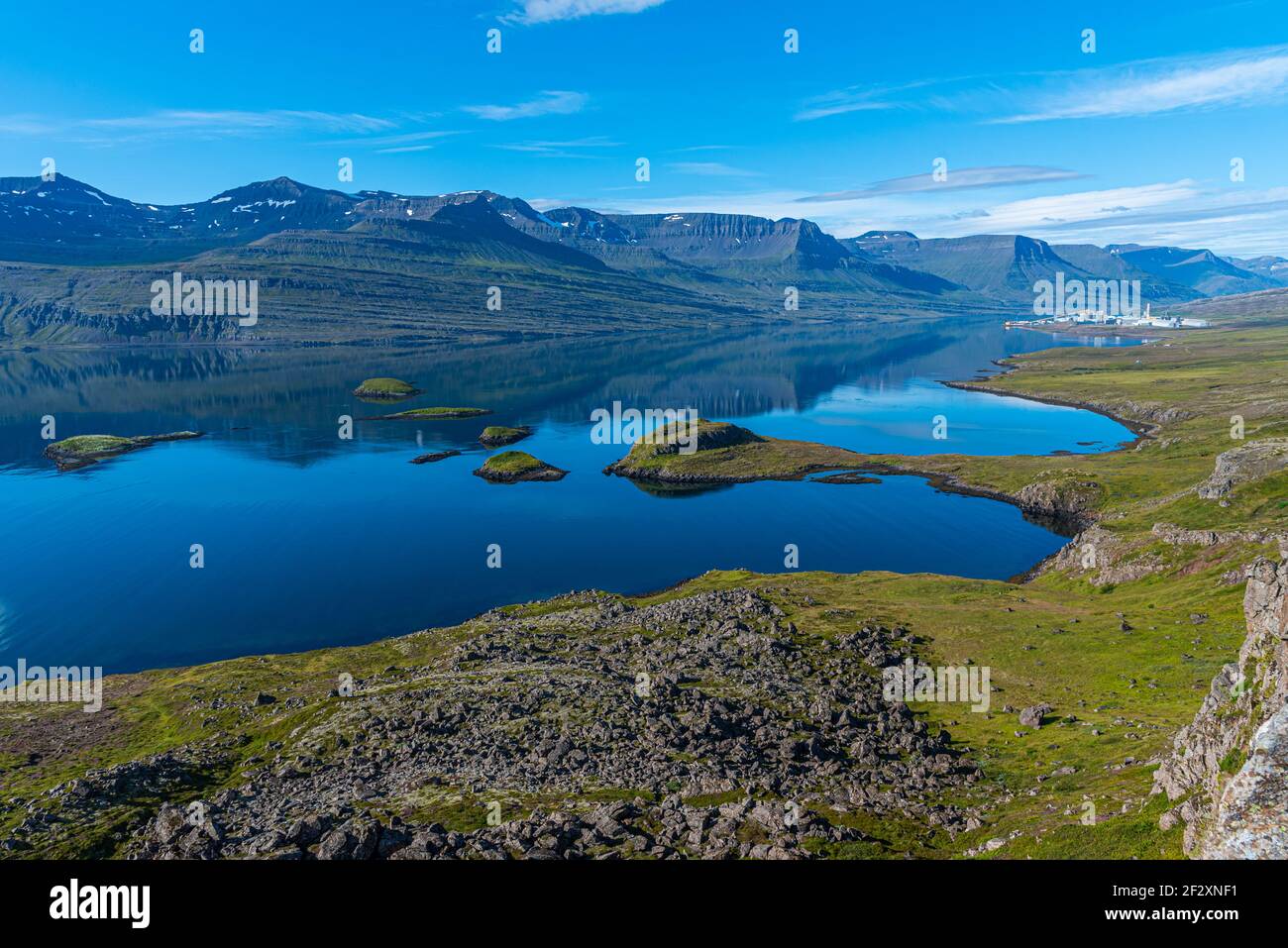 Natural landscape of Reydarfjordur and alluminium production facility ...