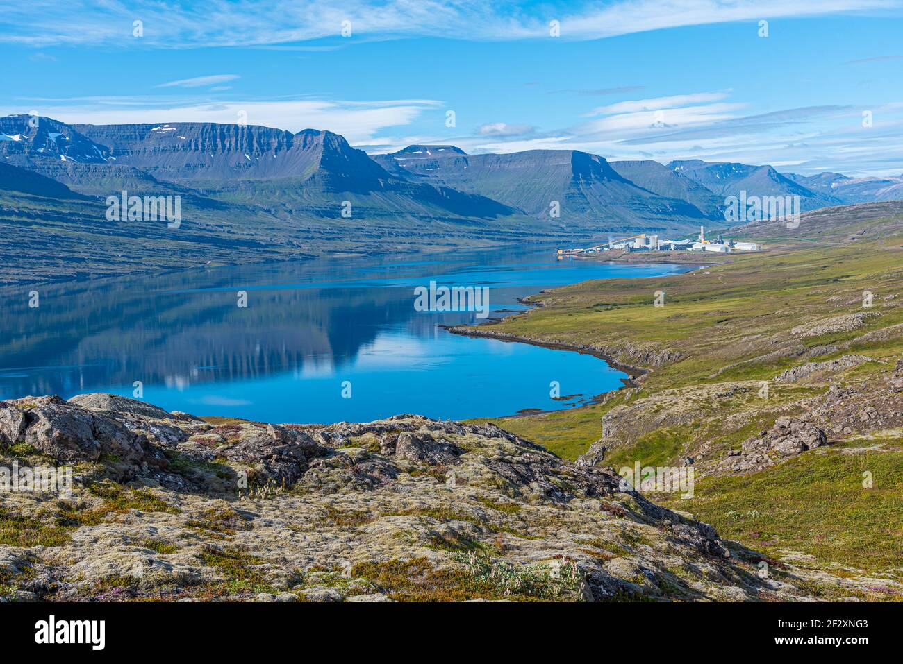 Natural landscape of Reydarfjordur and alluminium production facility ...