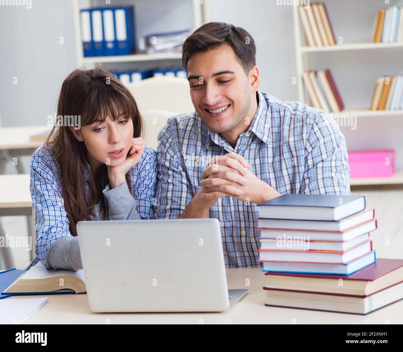 The students sitting and studying in classroom college Stock Photo - Alamy