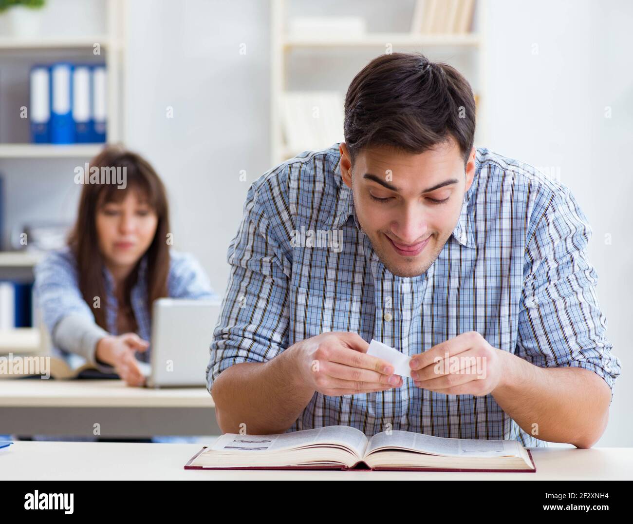 The students sitting and studying in classroom college Stock Photo - Alamy
