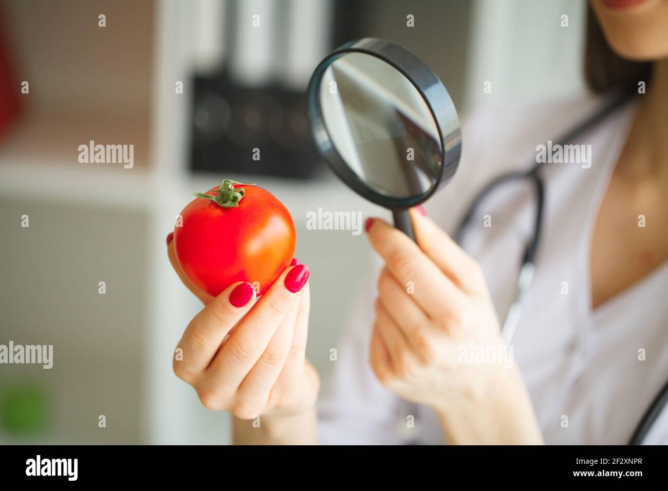 Diet Concept. Dietitian Inspecting Vegetables with Magnifying Glass ...