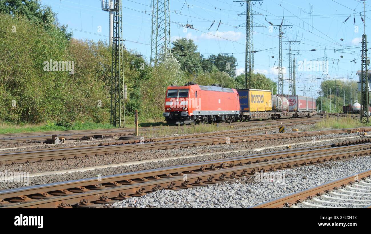 A class 185 EuroSprinter electric powered locomotive with goods wagons ...