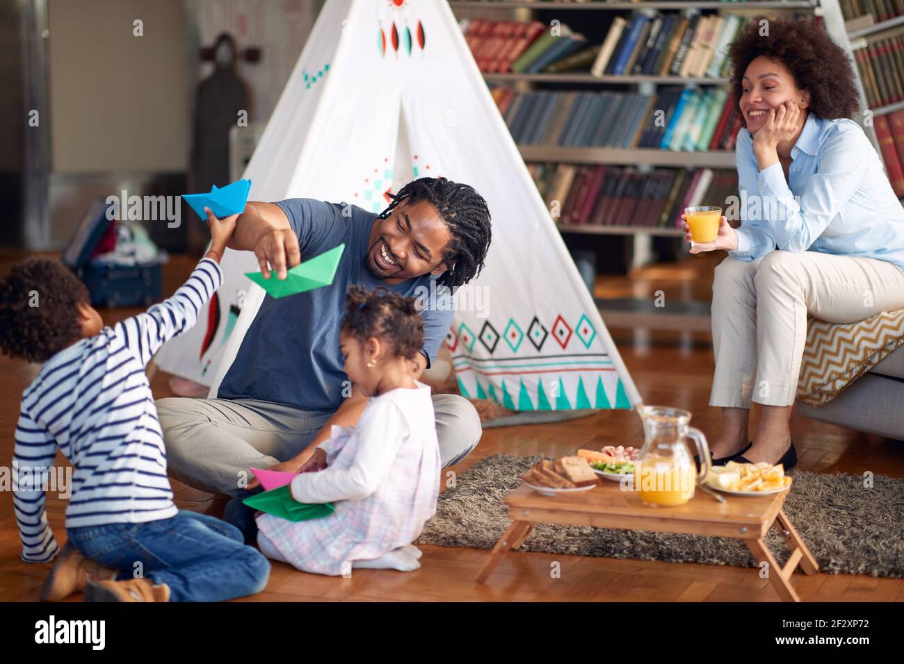 Happy family spending time in a cheerful atmopshere at home together ...