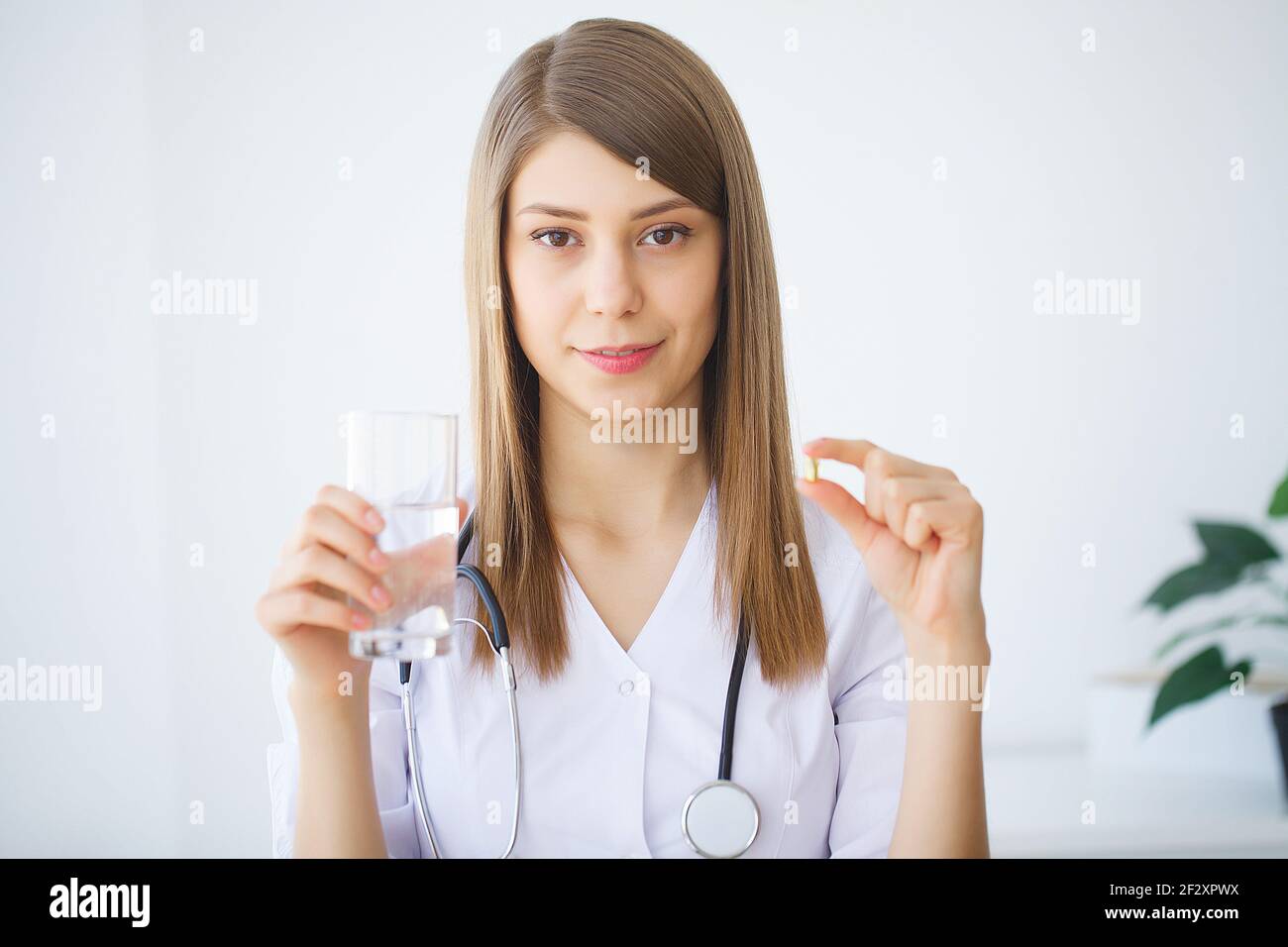 Clinic. Portrait of young doctor standing in medical office Stock Photo ...