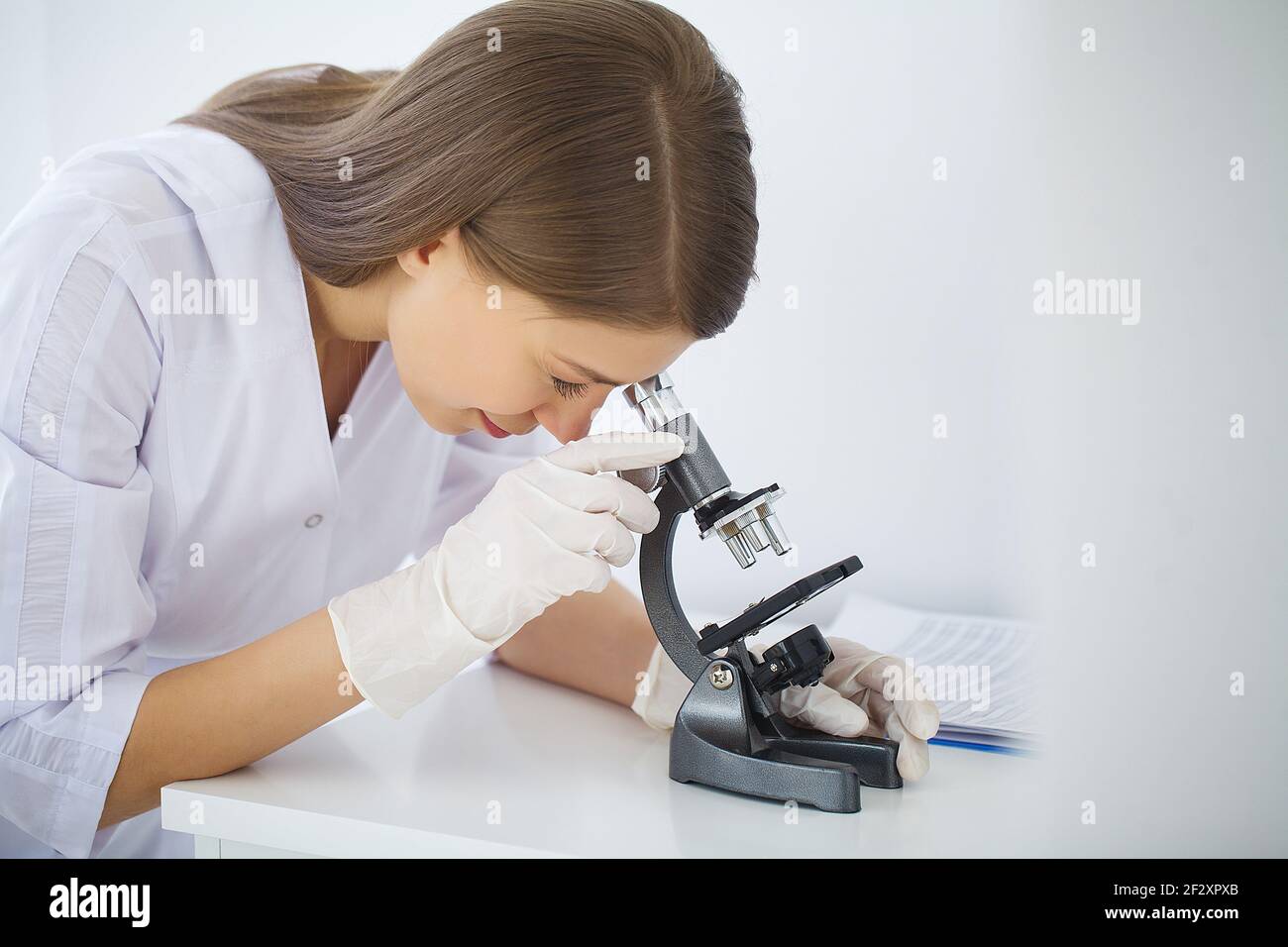 Clinic. Portrait of young doctor standing in medical office Stock Photo ...