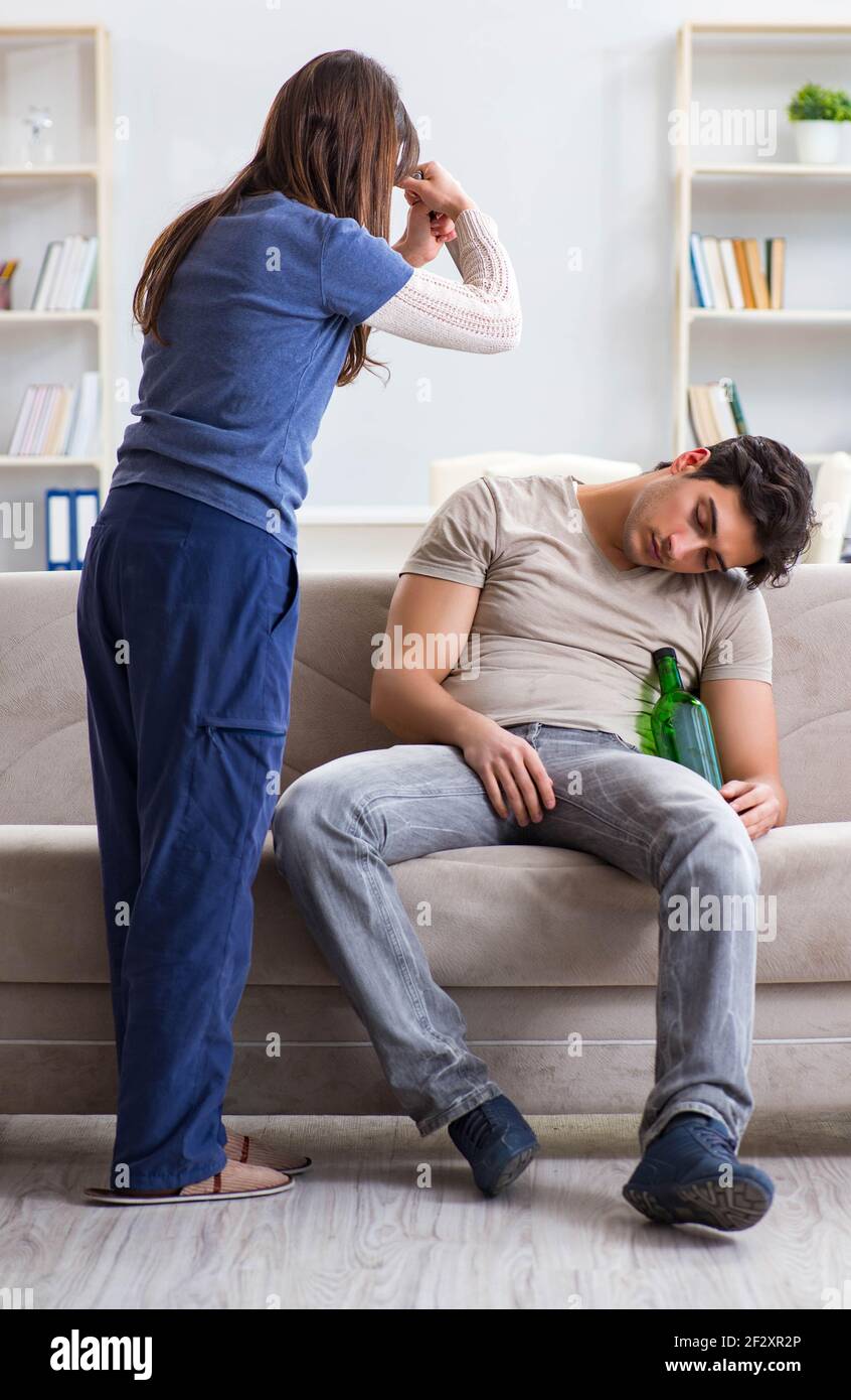The desperate wife attempting to kill husband Stock Photo - Alamy