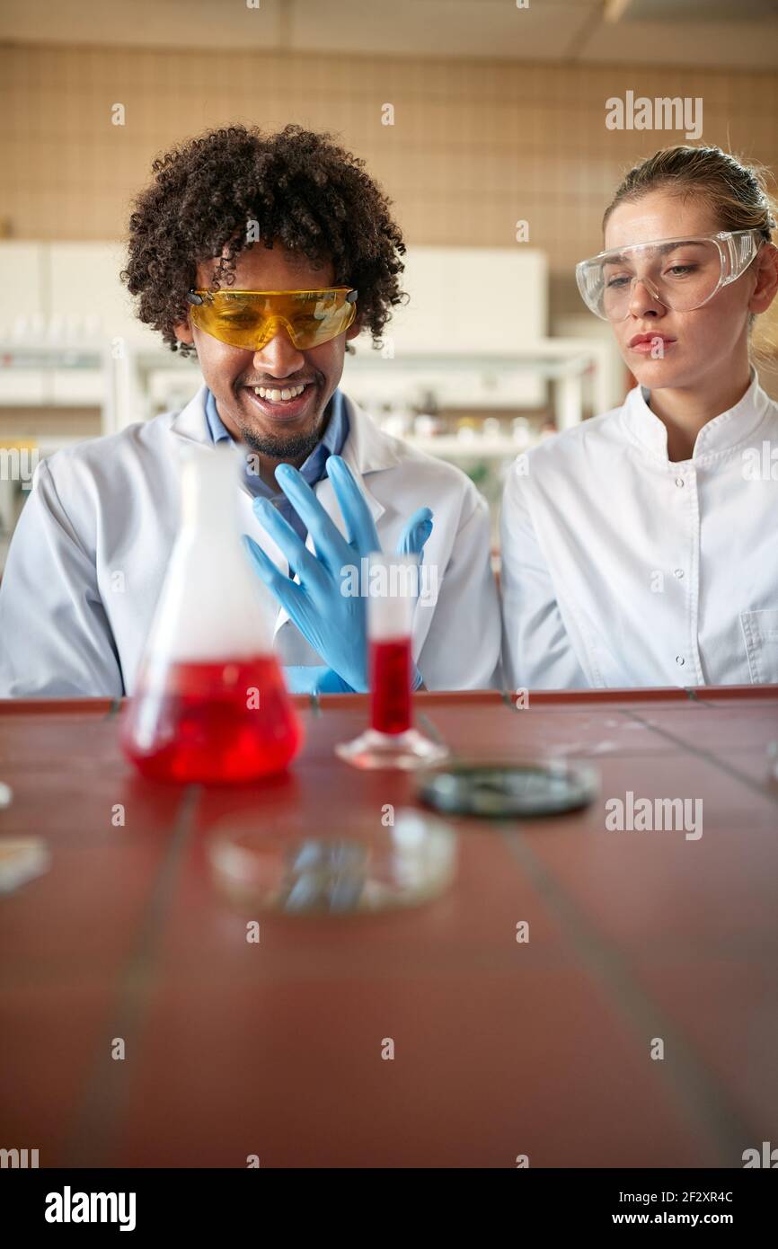 Two medical students conducting chemical experiment in the lab Stock ...