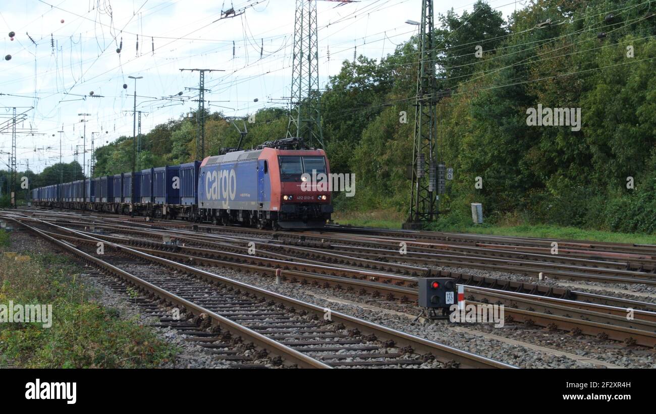 A electric powered locomotive with goods wagons, operated by SBB Cargo ...