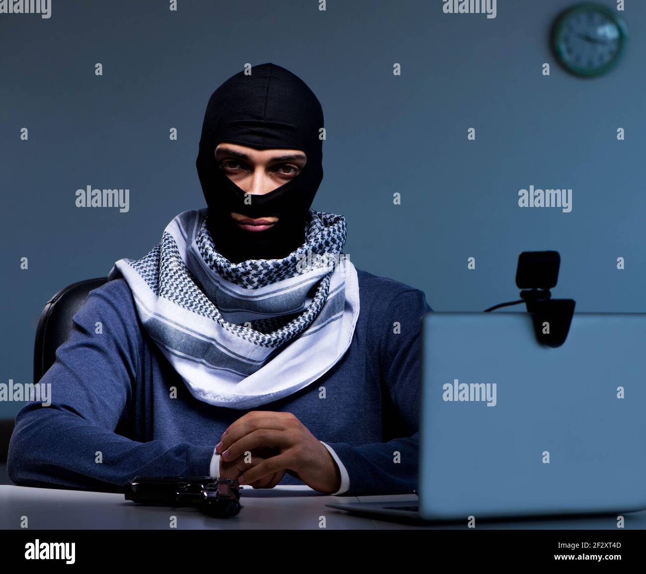 The hacker wearing balaclava mask hacking computer Stock Photo - Alamy