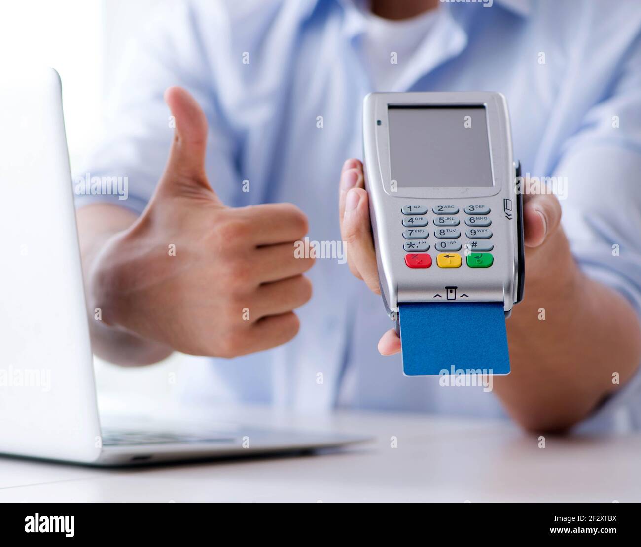 The man processing credit card transaction with pos terminal Stock ...