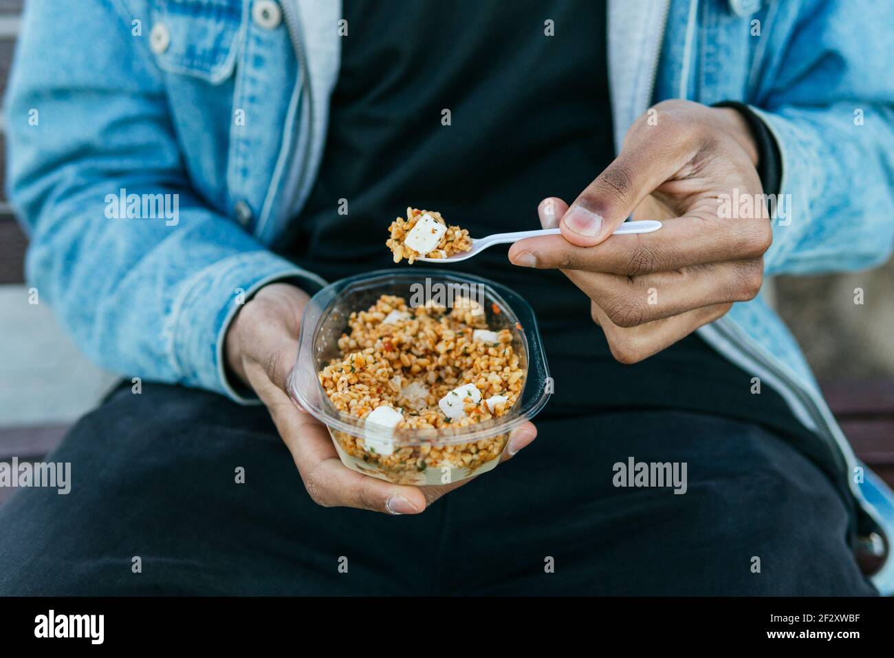 Crop anonymous ethnic male with appetizing healthy food with soft ...