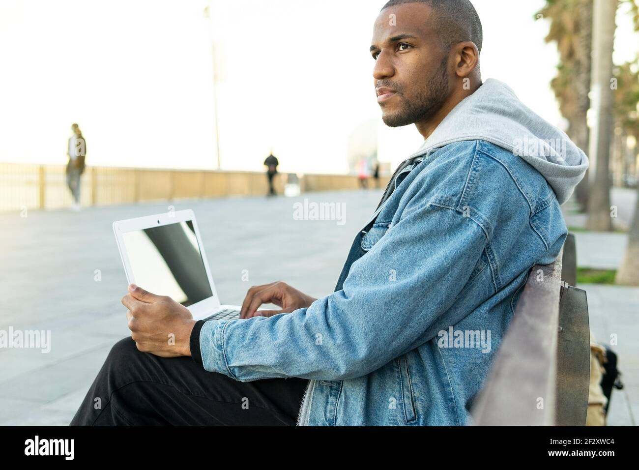 Side view of ethnic African american adult male remote employee with ...