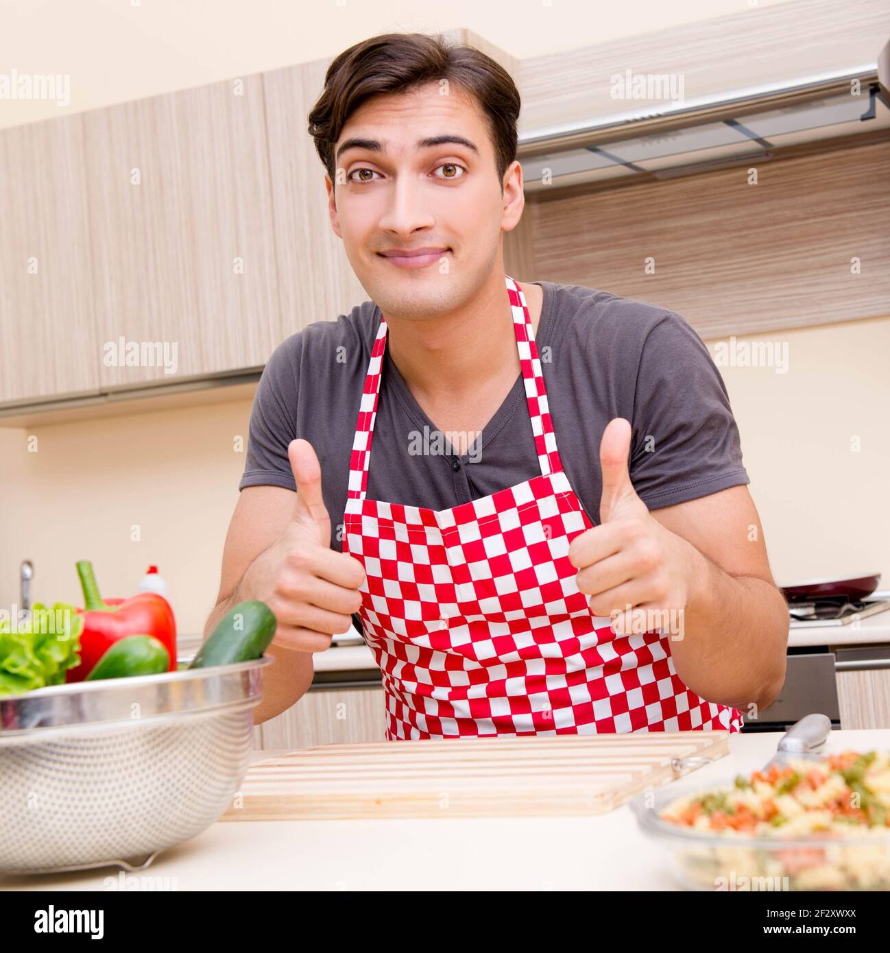 The man male cook preparing food in kitchen Stock Photo - Alamy