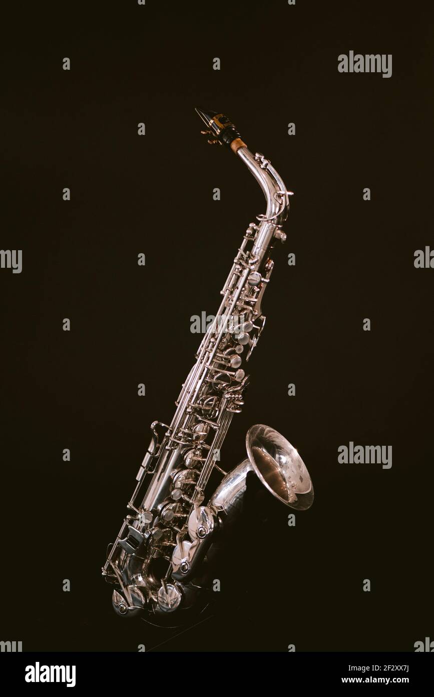 Contemporary classic brass wind instrument saxophone isolated on black ...