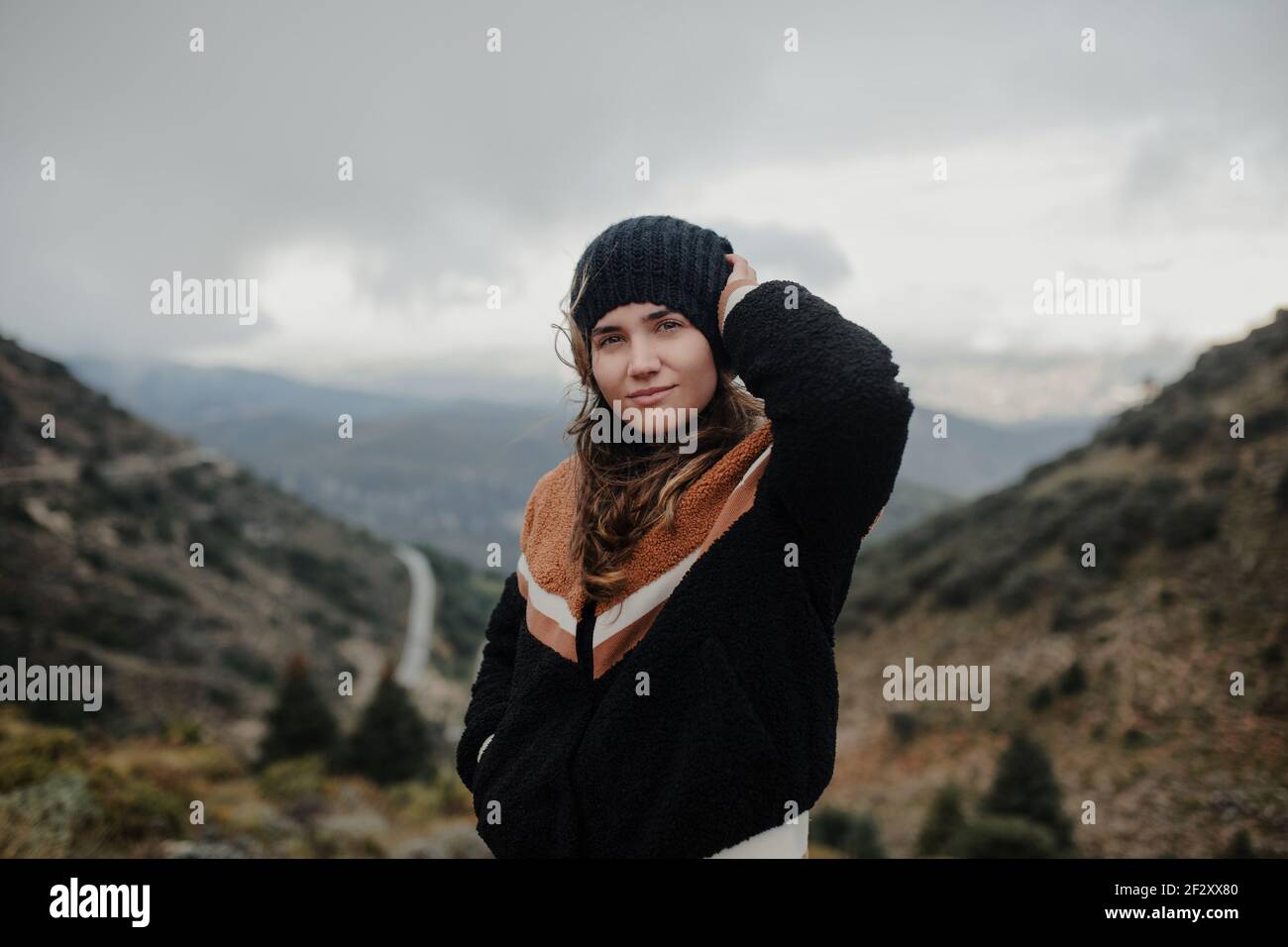 Side view of pensive African American male with curly hair in trendy ...