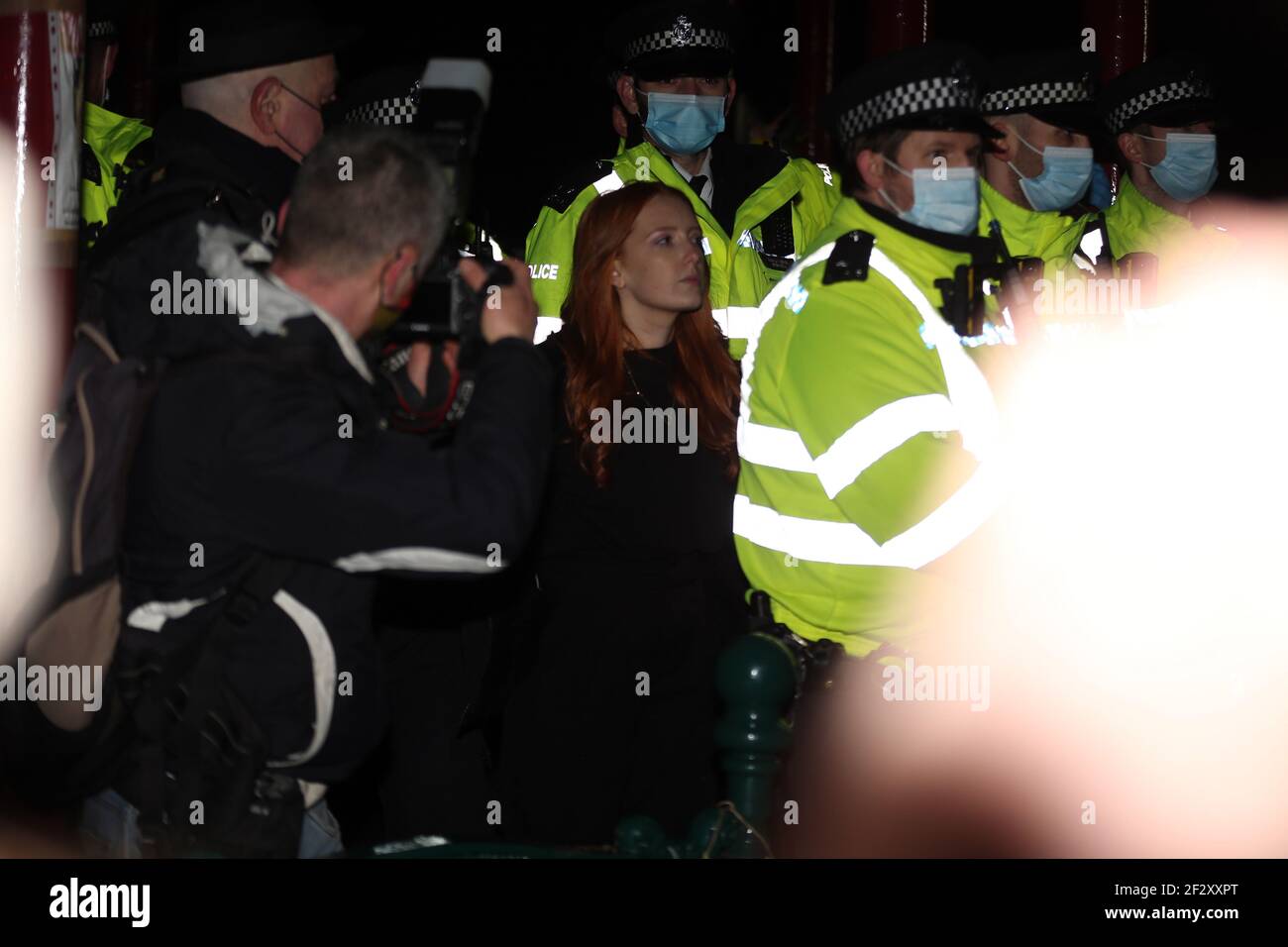 London, England, UK. 13th Mar, 2021. Police arrest a woman ...