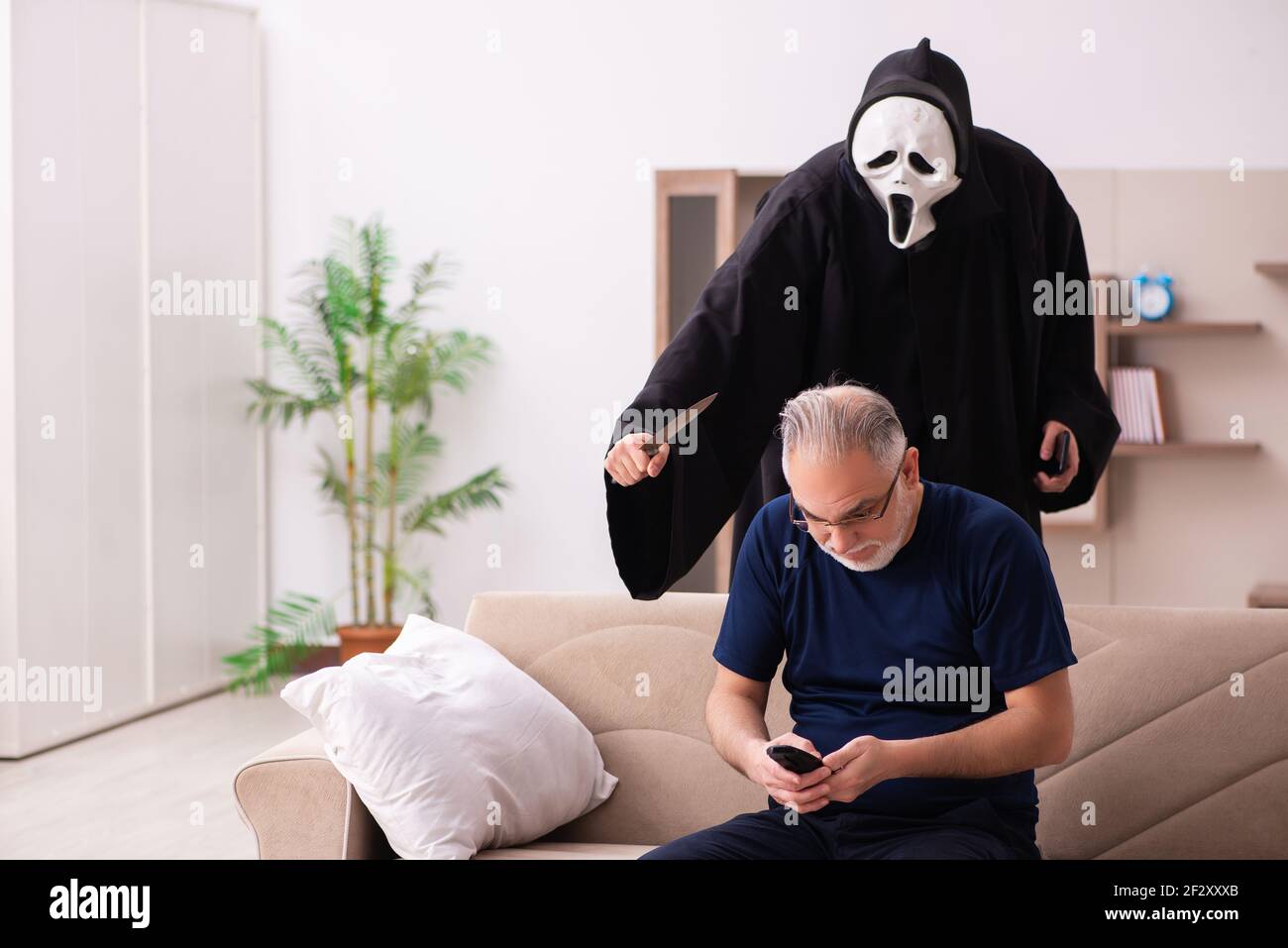 Old man phone evil hi-res stock photography and images - Alamy