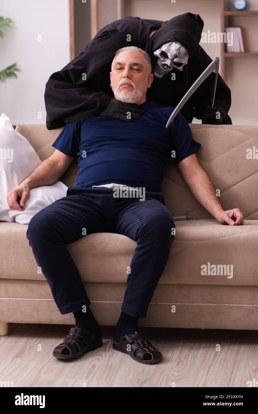 Devil coming to old dying man Stock Photo - Alamy