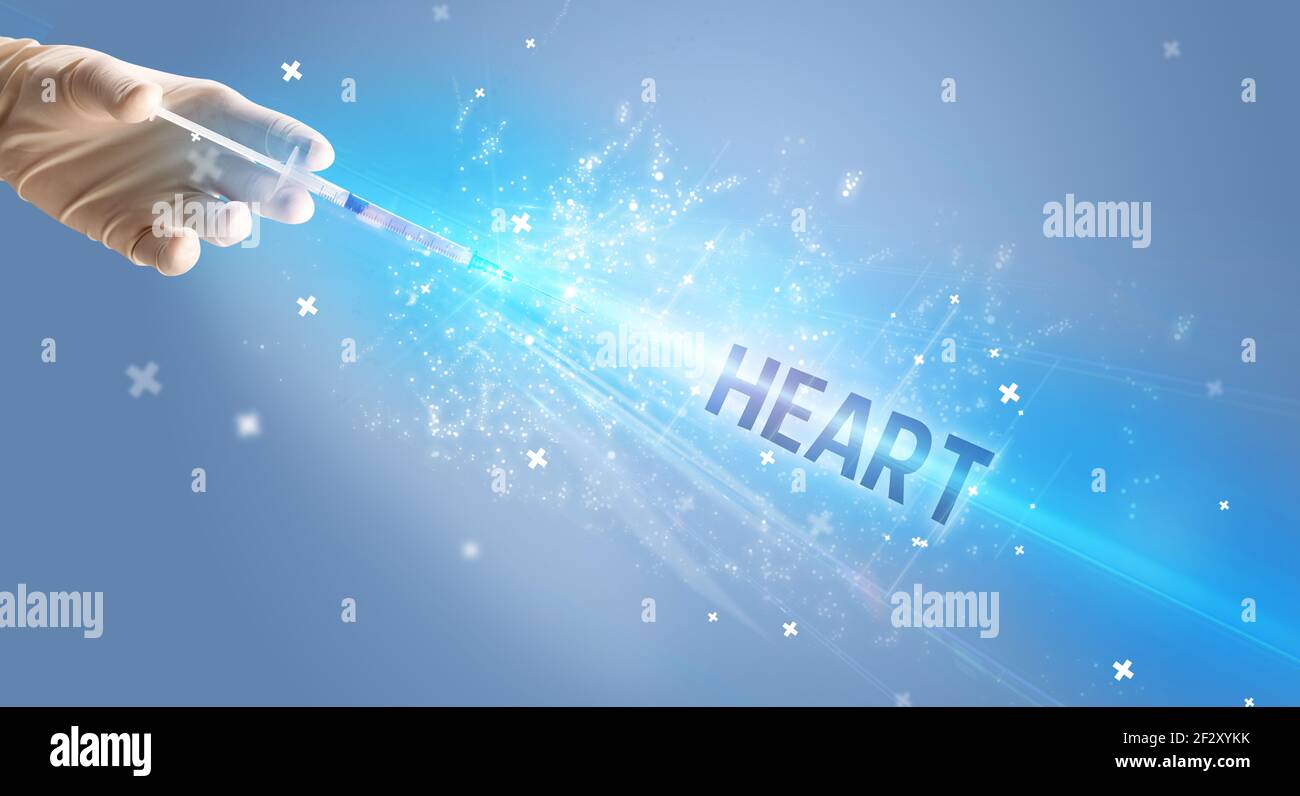 Syringe, medical injection in hand Stock Photo - Alamy
