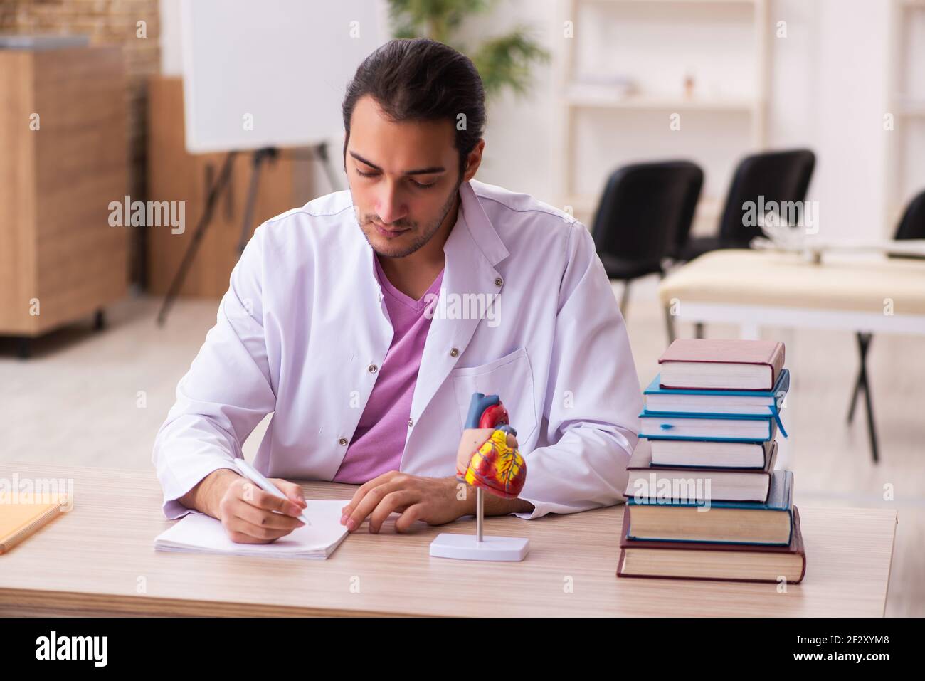 Young doctor student cardiologist sitting in the classroom Stock Photo ...