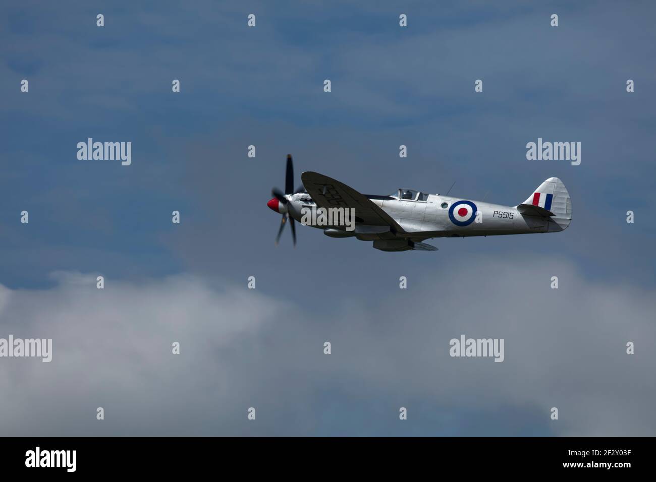 Spitfire Plane in Flight in the sky Stock Photo - Alamy