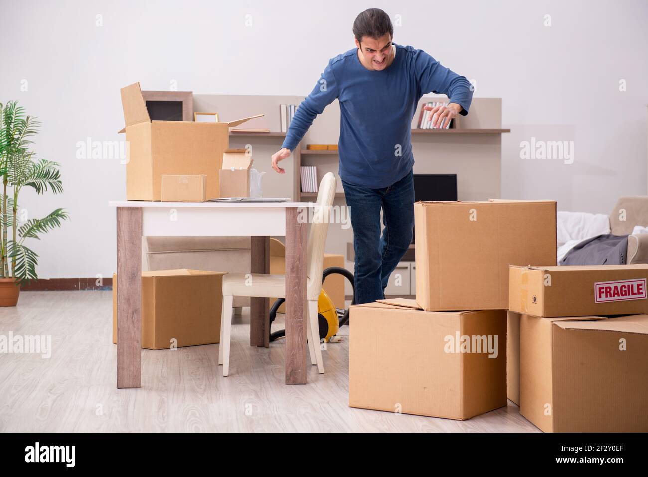 Angry young man parcel hi-res stock photography and images - Alamy