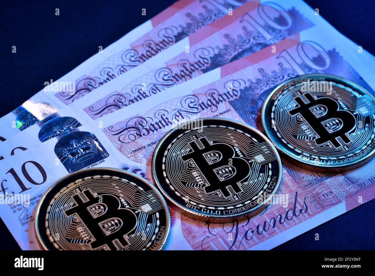 Digital currency physical metal bitcoin coin and pound sterling british ...