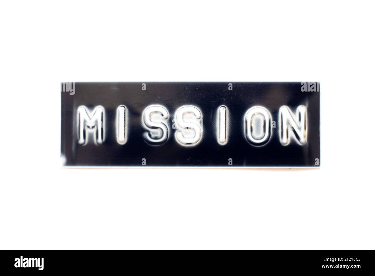 Embossed letter in word mission on black banner with white background ...