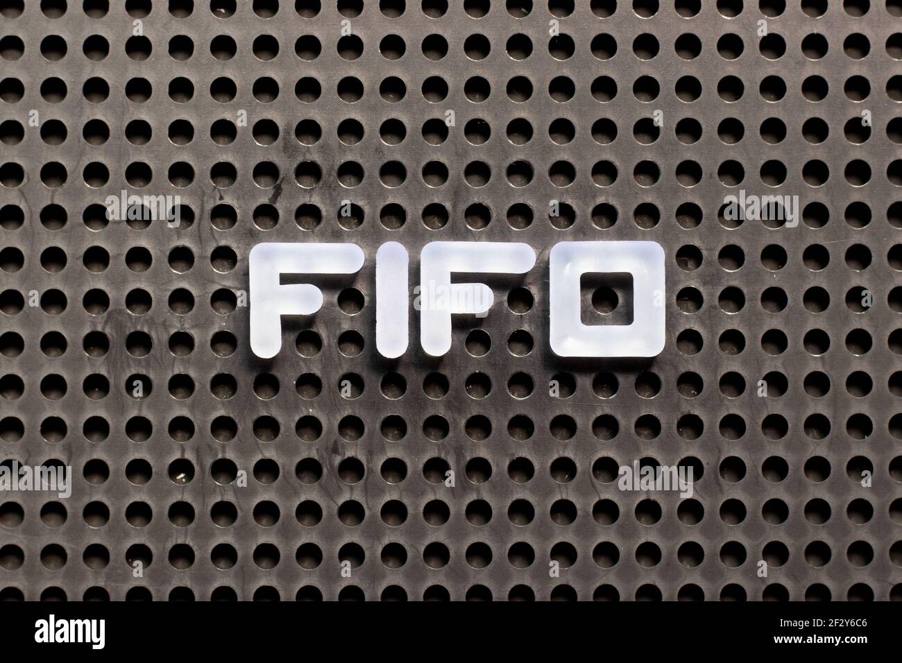 White color letter in word FIFO (Abbreviation of first in first out) on ...