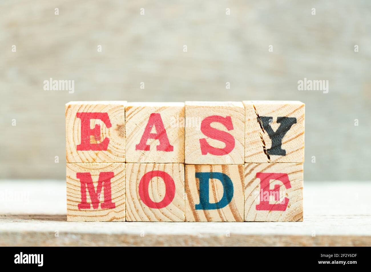 Alphabet letter block in word easy mode on wood background Stock Photo ...