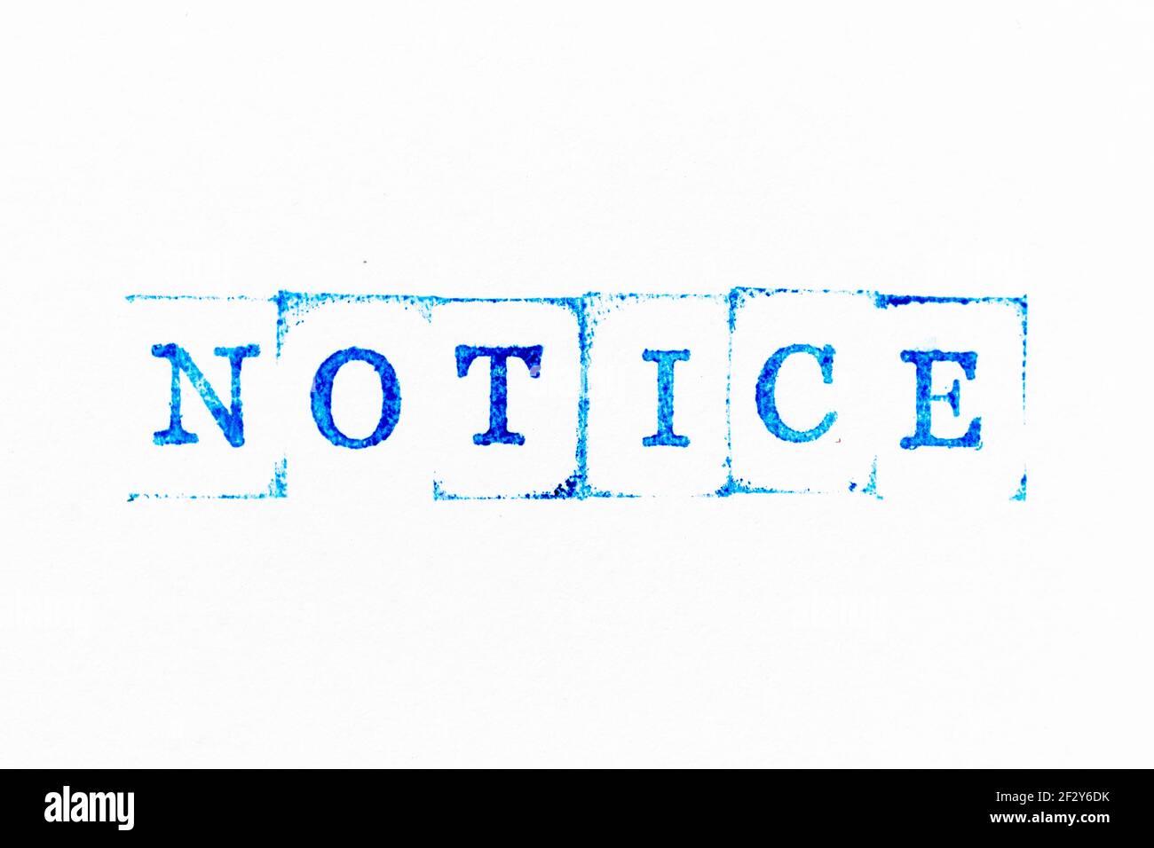 Blue color ink rubber stamp in word notice on white paper background ...