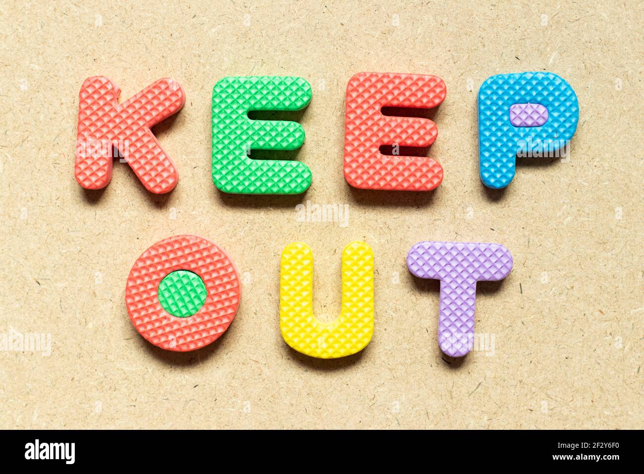 Foam alphabet letter in word keep out on wood background Stock Photo ...