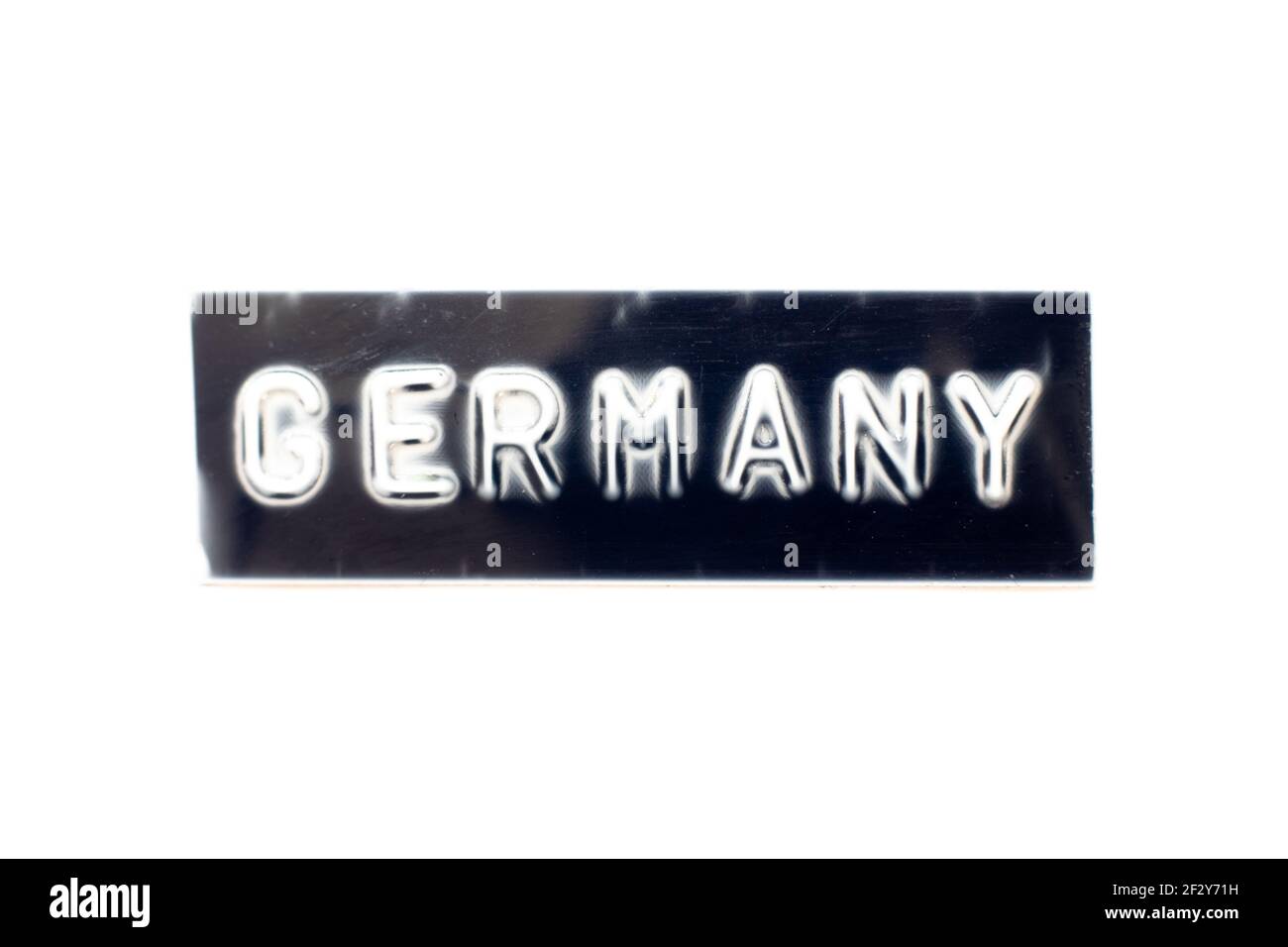 Embossed letter in word germany on black banner with white background ...