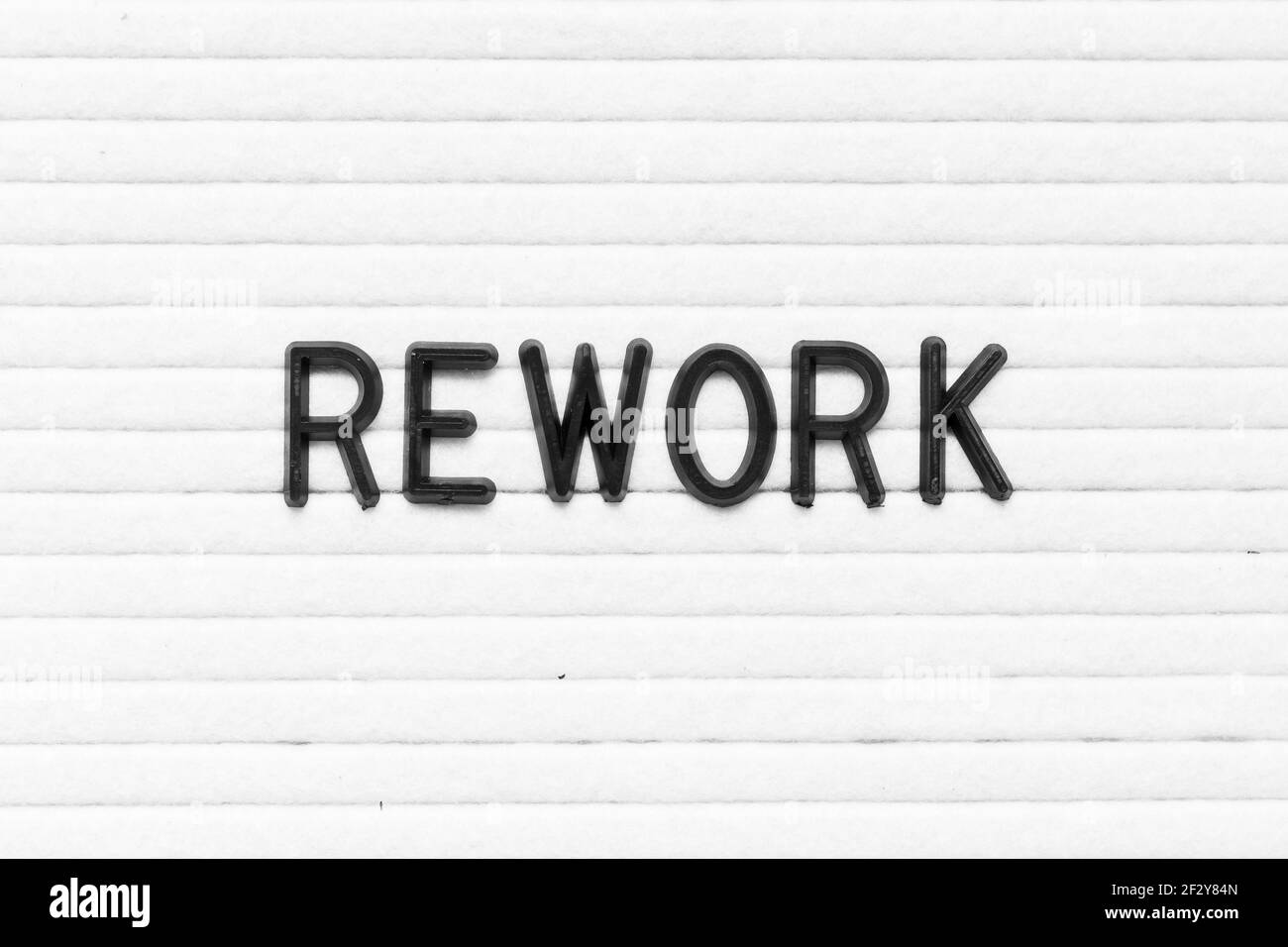 Black color letter in word rework on white felt board background Stock ...