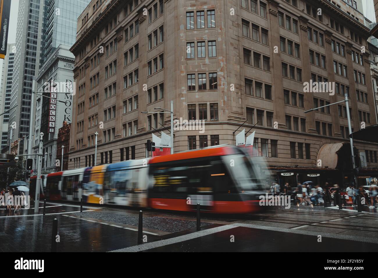 A light rail car crosses the intersection of Market St and George ...