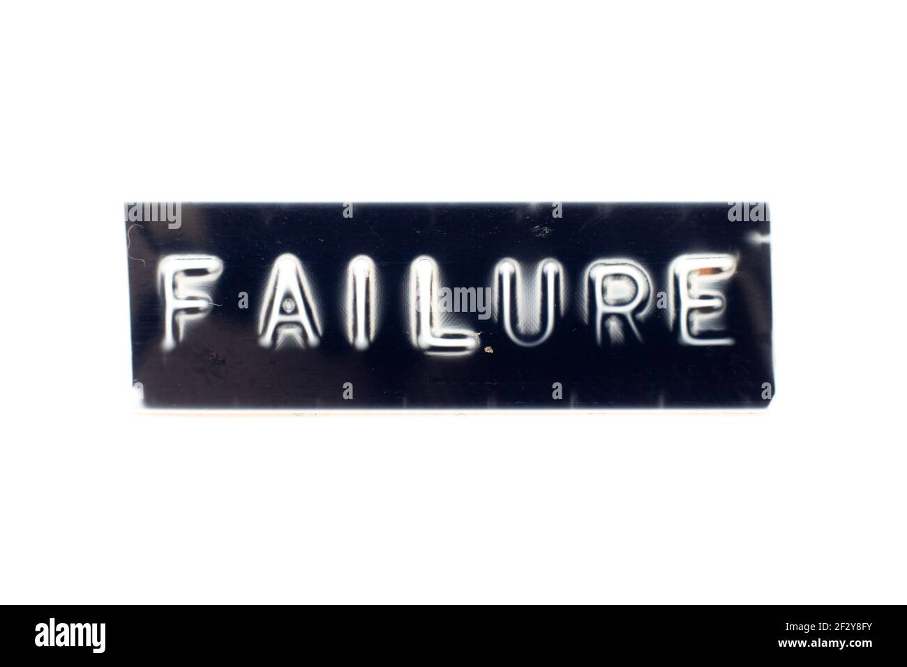 Embossed letter in word failure on black banner with white background ...