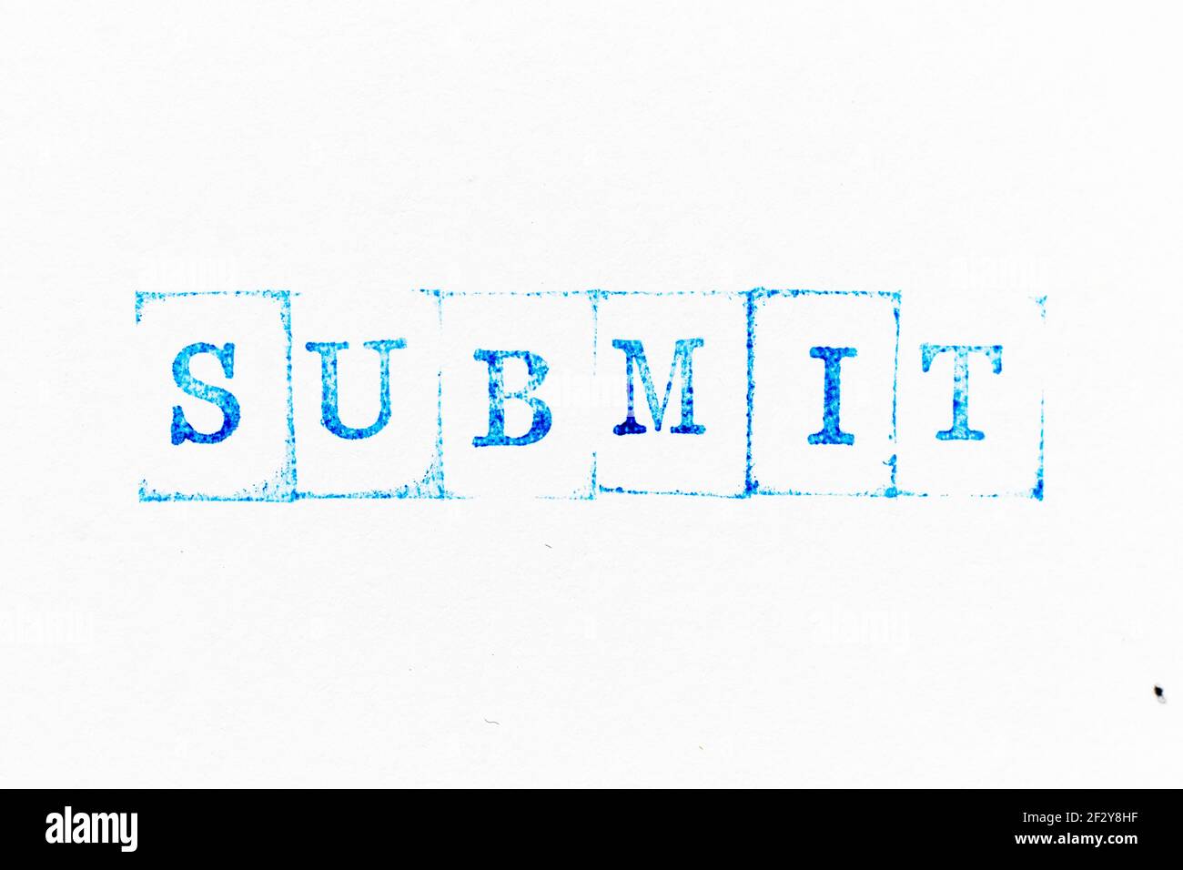 Blue color ink rubber stamp in word submit on white paper background ...