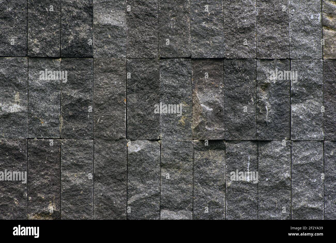 Natural dark plaid stone wall background and backdrop Stock Photo - Alamy