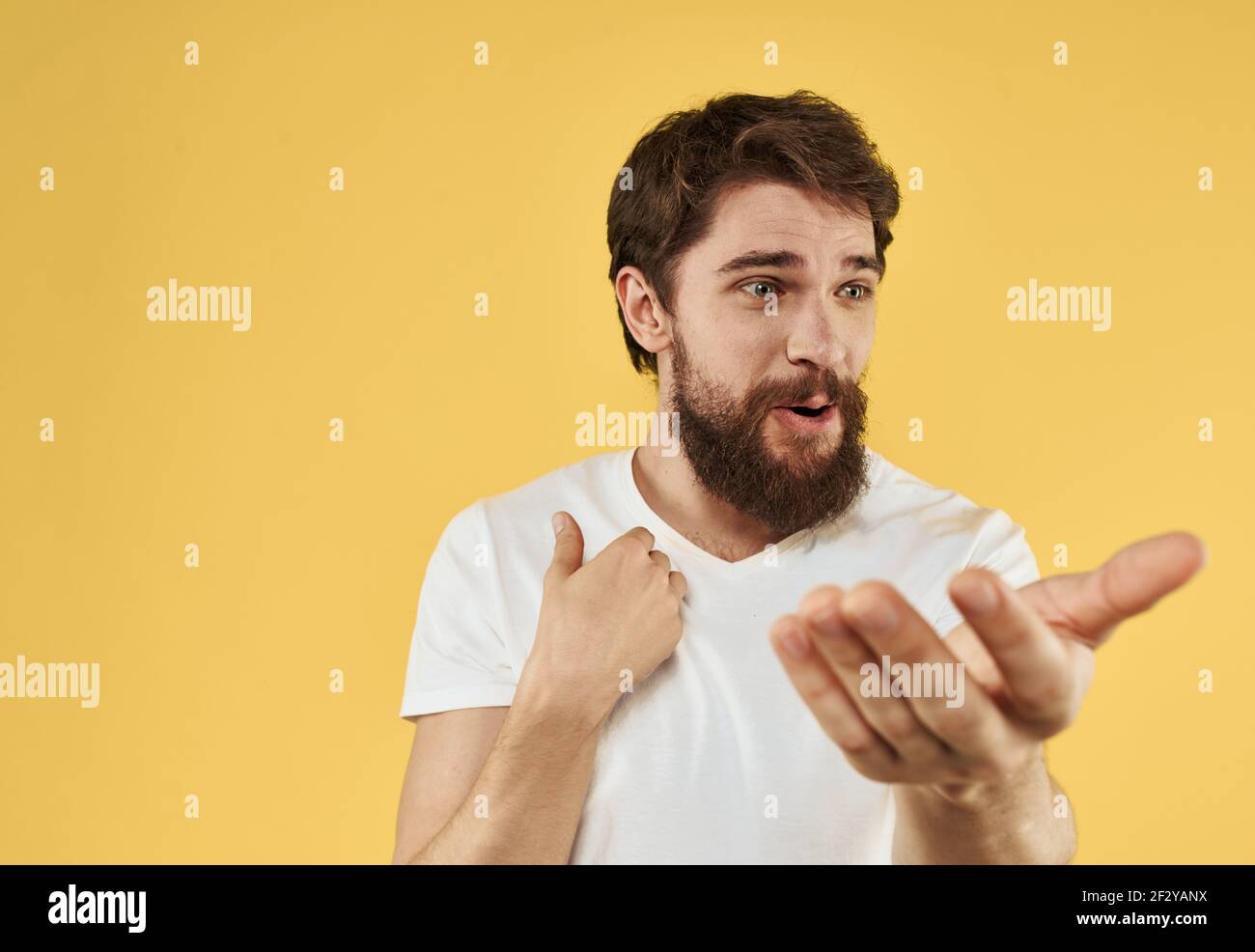 Man shows positive hand gesture emotions fun yellow background Stock Photo - Alamy