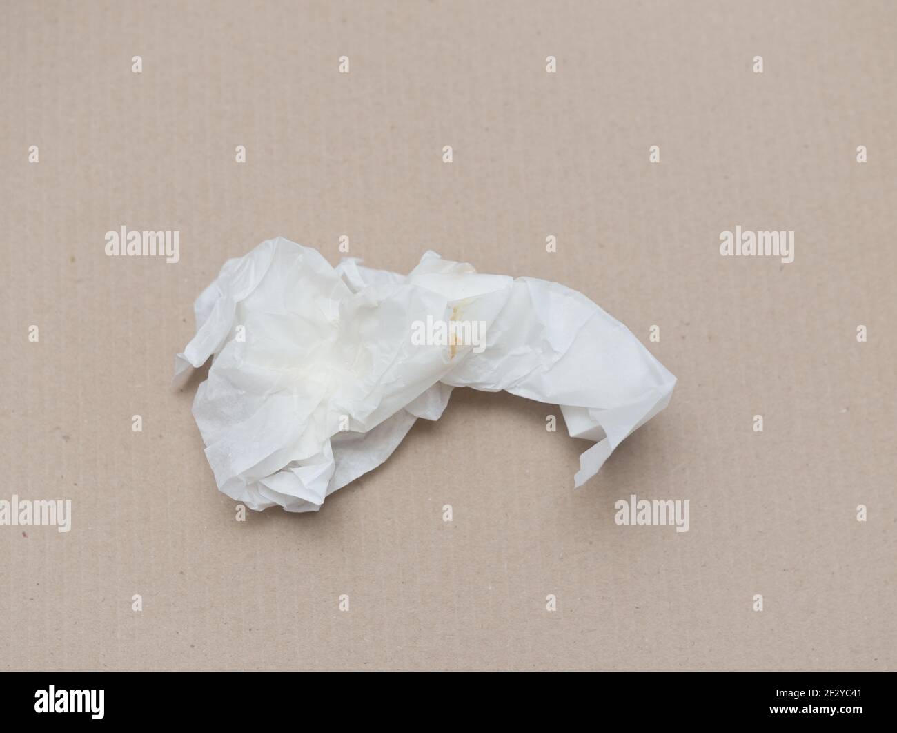 Paper ball on cardboard background Stock Photo - Alamy