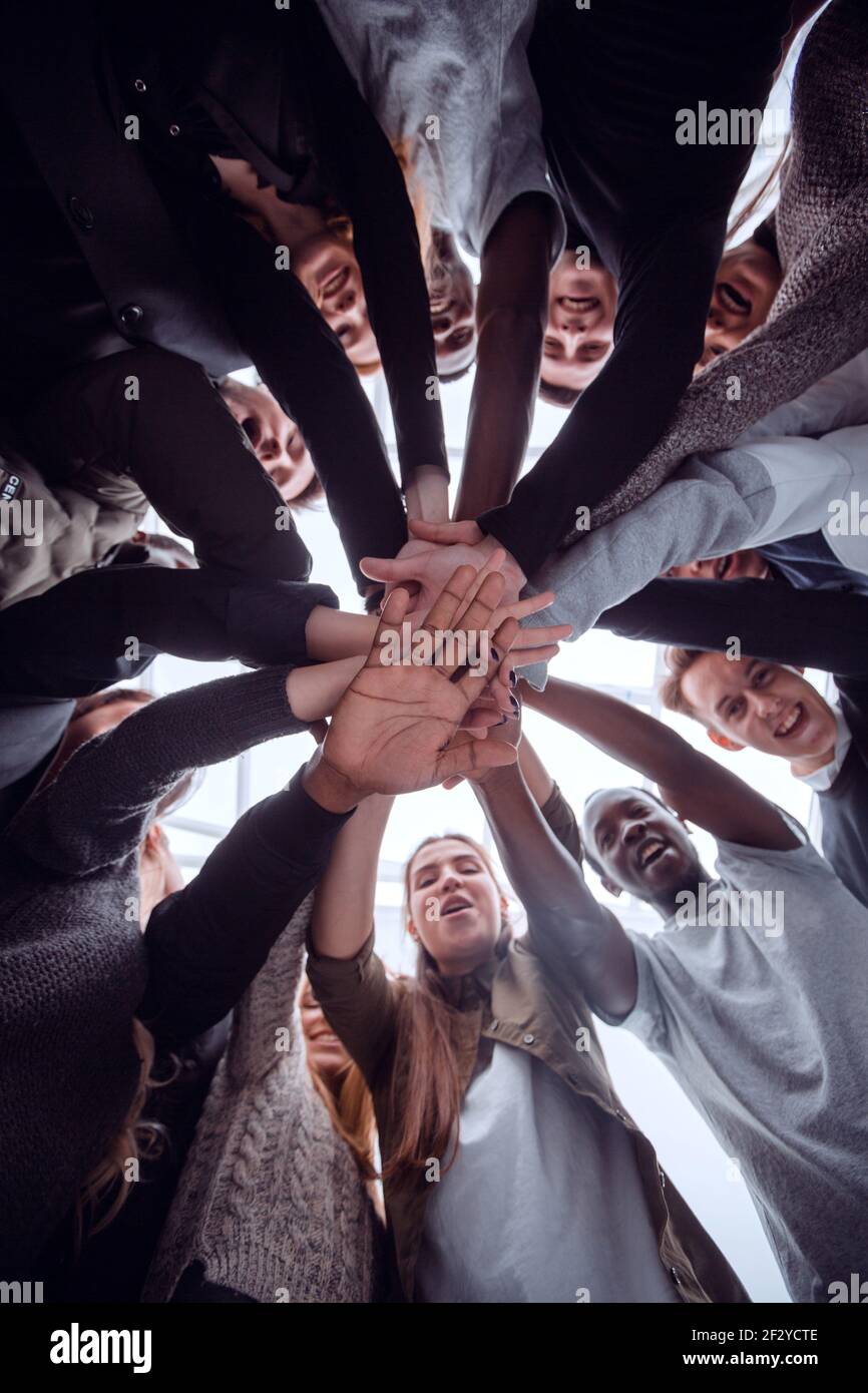 bottom view. group of happy young people making a stack of hands Stock ...