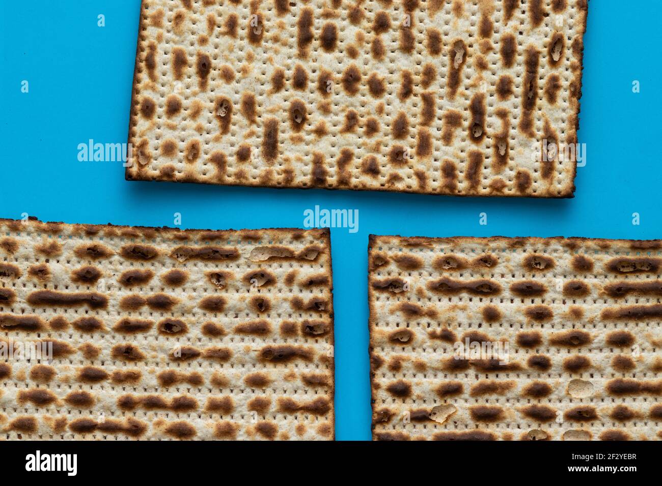 A close-up of three matzahs - bread for the Jewish Passover, on a light ...