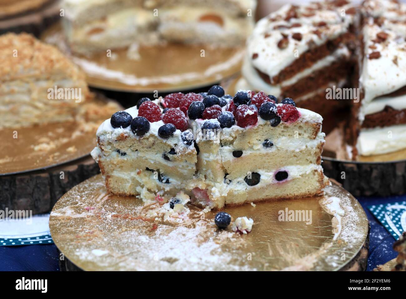 Cakes at the buffet on a table Stock Photo - Alamy