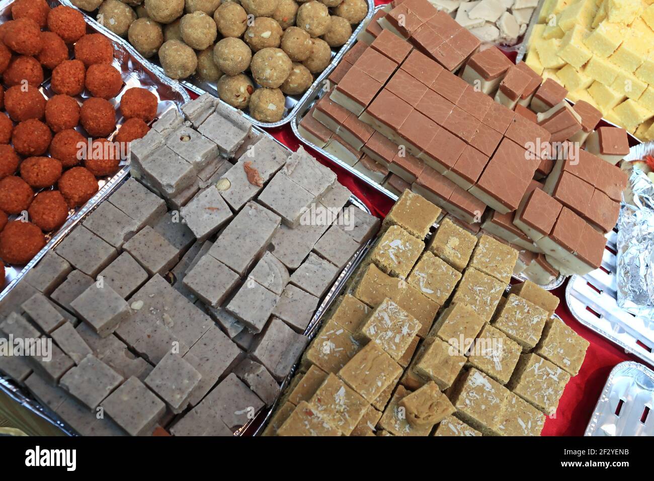 The indian sweets on the counter an market Stock Photo - Alamy