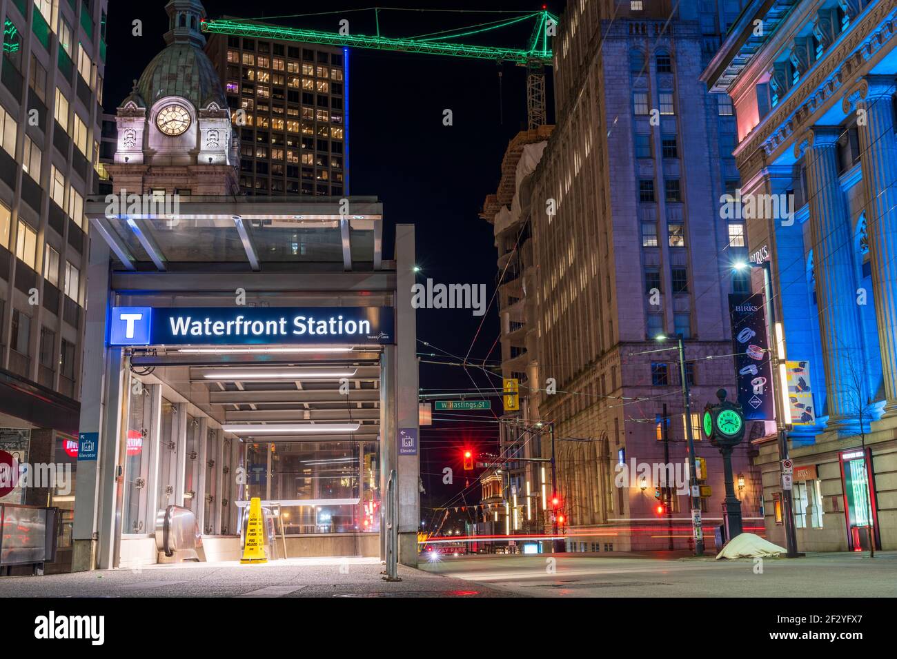 Night street view of The Waterfront Station subway escalator exit ...