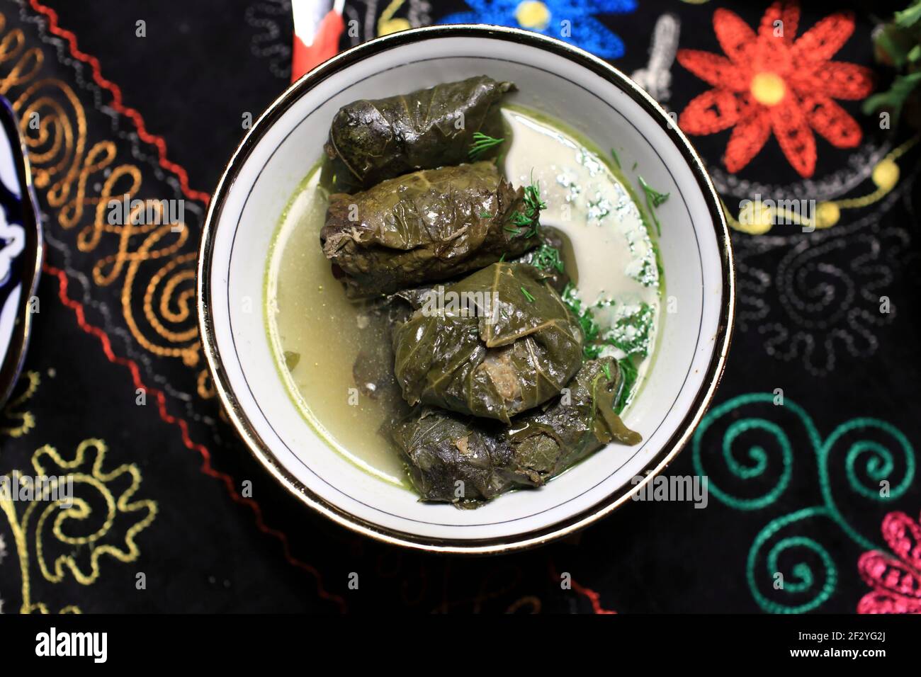 Grape leaf dolma on the plate at the uzbek restaurant Stock Photo - Alamy