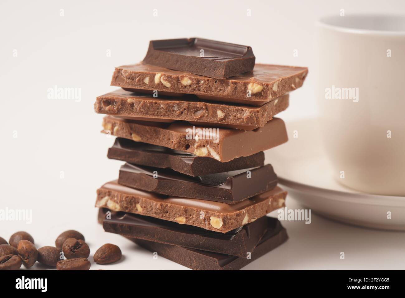 Chocolate tower. Stack of chocolate pieces. The chunks of broken ...