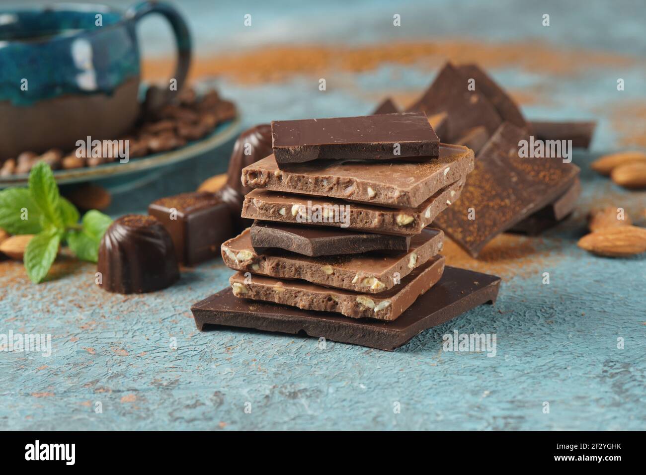 Chocolate tower. Stack of chocolate pieces. The chunks of broken ...